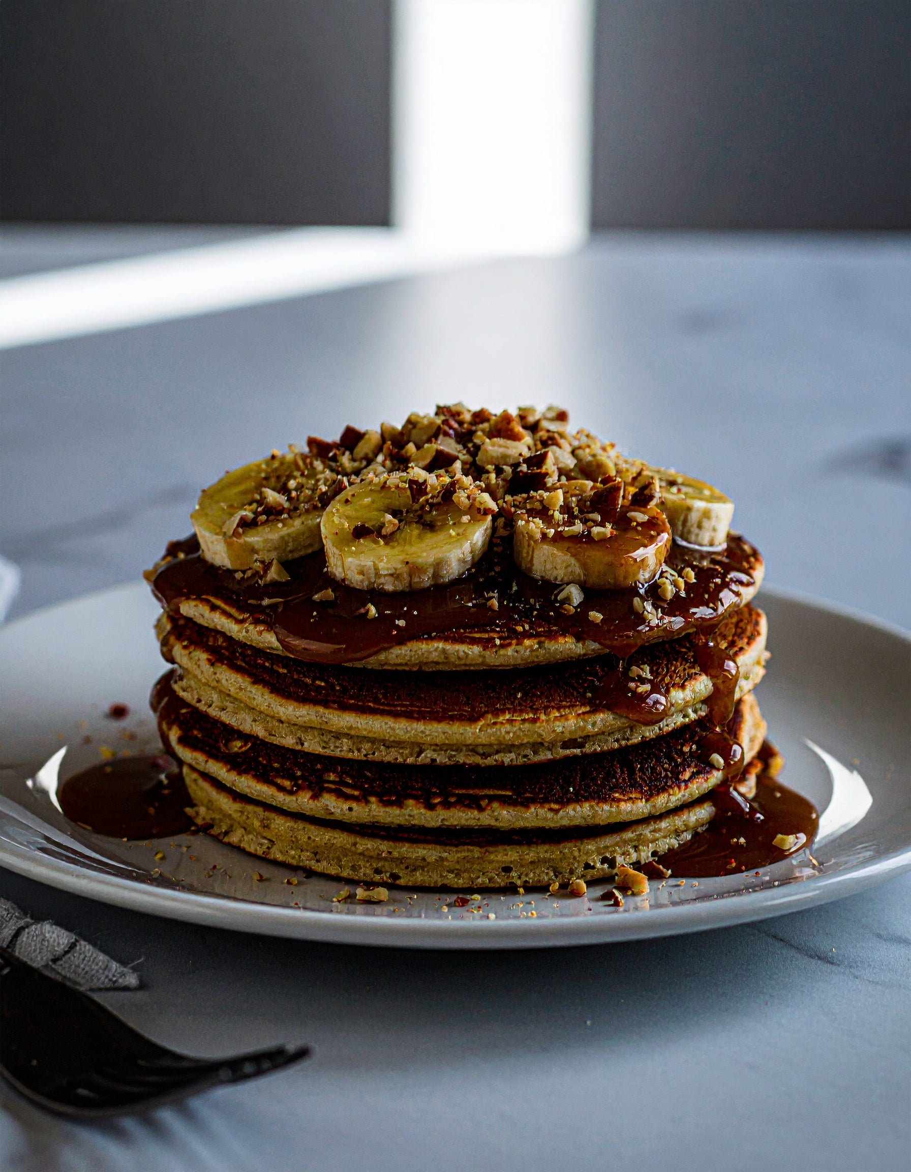 Pancakes layered with walnut butter & banana – Sun & Seed